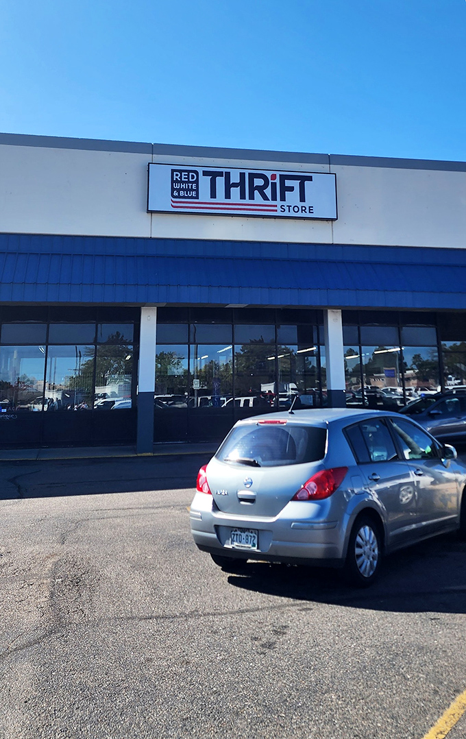 Like a beacon for bargain hunters, the Red White & Blue sign promises adventures in secondhand splendor just beyond those doors.