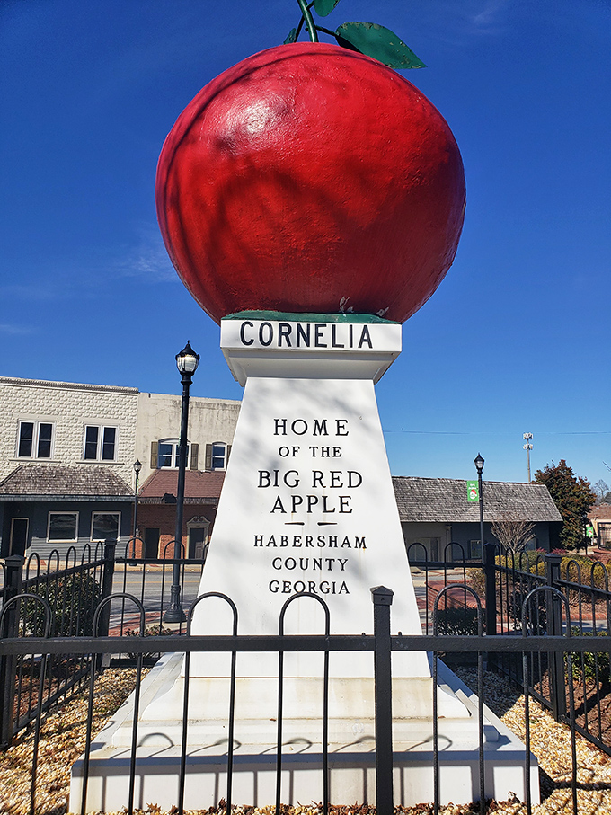The Big Red Apple stands proudly against a winter sky, like a crimson beacon calling all road-trippers to Cornelia's charming downtown.