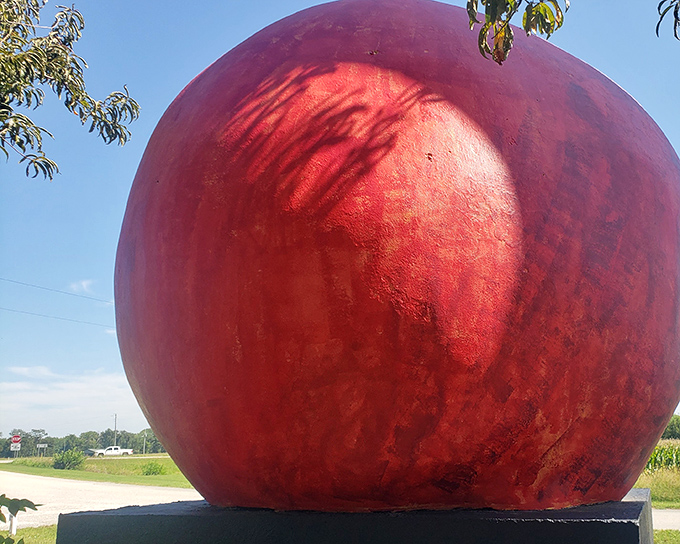 The crimson colossus of Bruceville stands proudly against the Indiana sky, like a fruity beacon calling road-weary travelers to stop and marvel.