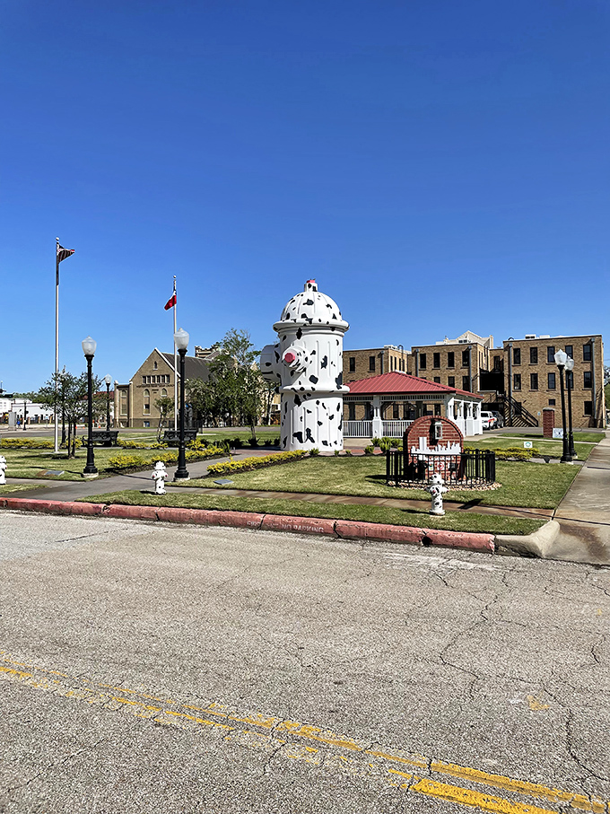 The magnificent spotted giant stands tall in downtown Beaumont, making every other fire hydrant feel inadequate.