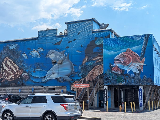The Reef's exterior mural transforms a simple building into an underwater fantasy world, making you wonder if the fish inside are on the walls or on your plate.