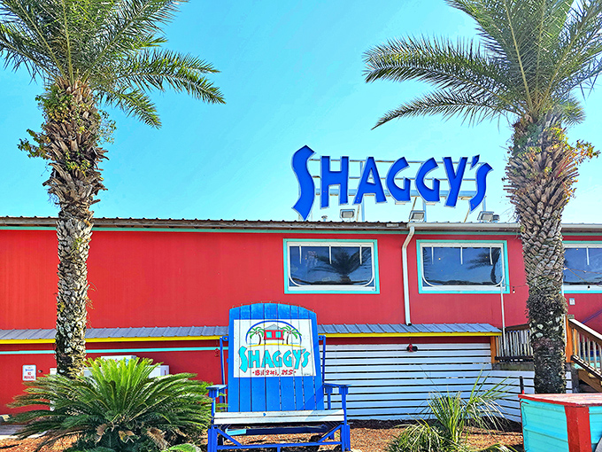 Shaggy's vibrant red exterior with towering palm trees isn't just a restaurant&mdash;it's a beacon of seafood salvation on Biloxi Beach.
