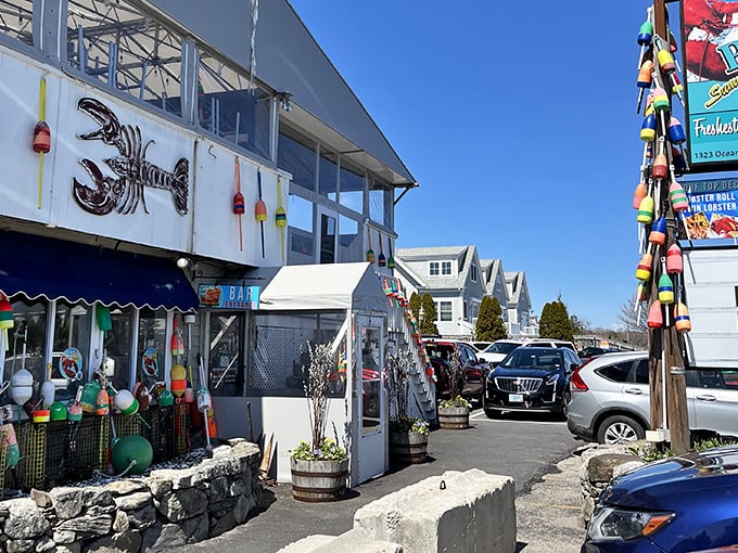 The iconic lobster silhouette against white siding says everything you need to know: you've arrived at seafood paradise in coastal New Hampshire.