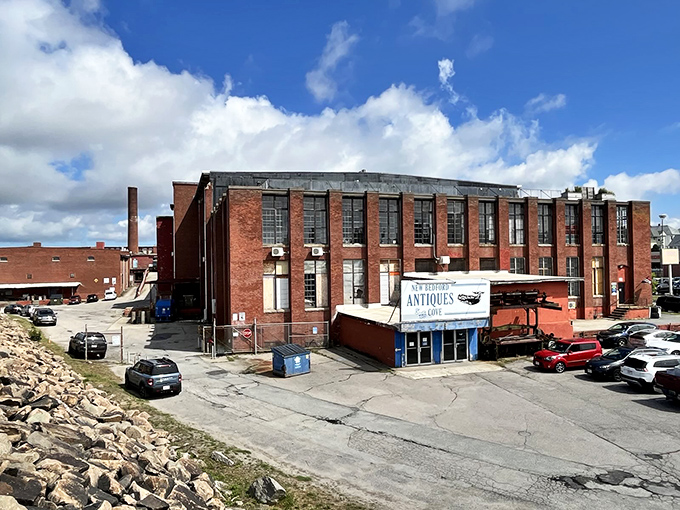 The imposing brick exterior of New Bedford Antiques at the Cove stands like a time capsule waiting to be explored.