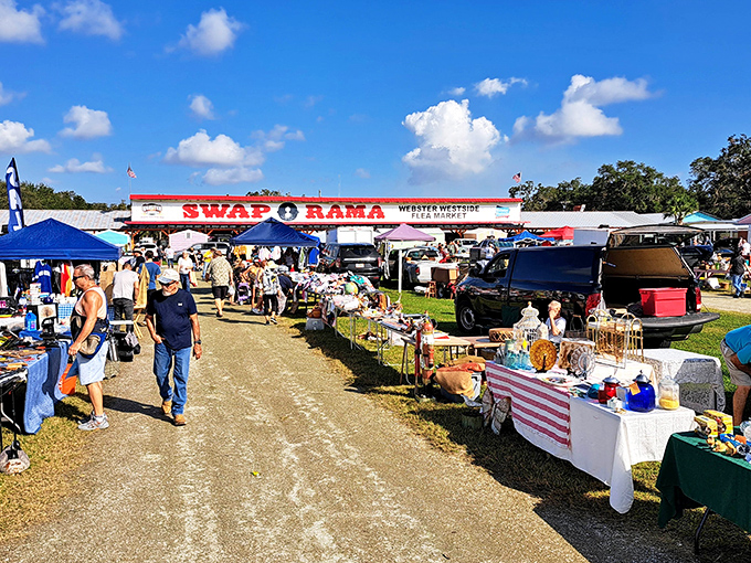 The gateway to bargain paradise beckons under Florida's impossibly blue sky, where twenty bucks in your pocket feels like winning the lottery.