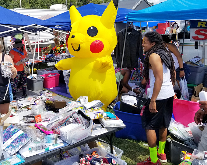 Not just any mascot – a giant Pikachu presiding over treasures like a cheerful guardian of pop culture past and present.