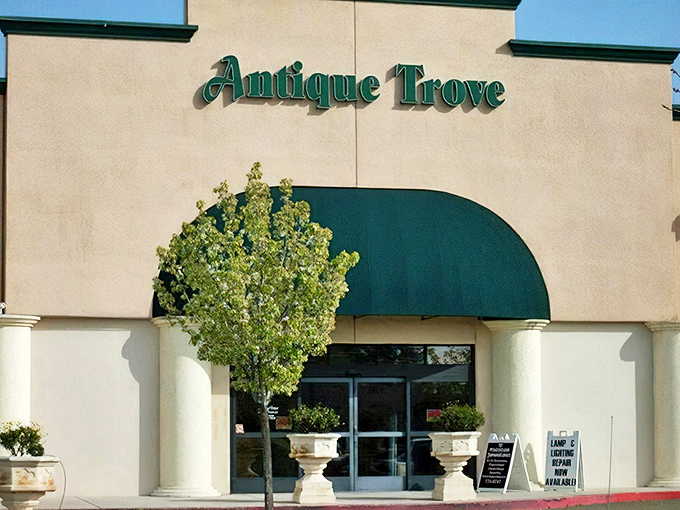 The stately exterior of Antique Trove beckons with its green awnings and cream fa&ccedil;ade&mdash;like a time portal disguised as a suburban storefront.