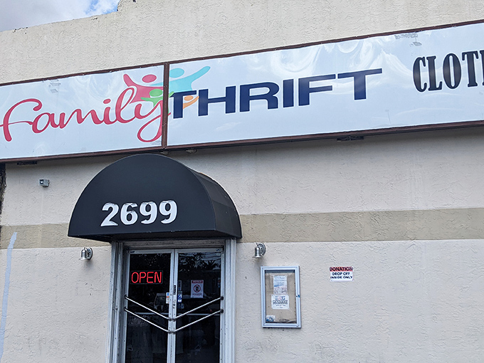 That glowing "OPEN" sign might as well say "Abandon all shopping lists, ye who enter here." The thrift store siren song begins at this humble doorway.