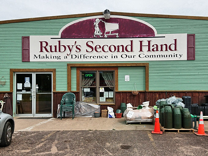 The mint-green exterior of Ruby&rsquo;s Second Hand catches the eye, its bold burgundy sign inviting thrifters to uncover hidden gems inside.