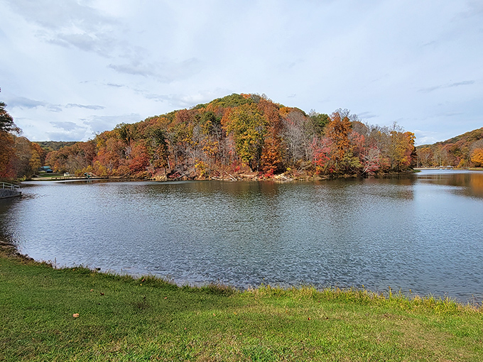 Mother Nature's mirror game is unbeatable at Pine Lake in autumn, where hills draped in fiery foliage create a double feature of fall splendor.