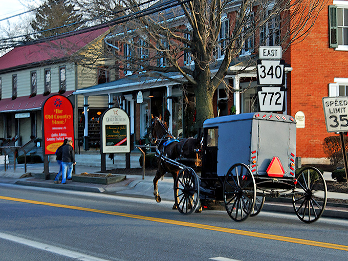 Where horse-drawn buggies and brick homes coexist in perfect harmony &ndash; a quintessential scene from Intercourse, Pennsylvania that feels like stepping into another era.