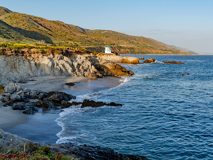 Mother Nature's masterpiece unfolds at Leo Carrillo, where rugged cliffs meet gentle waves. The iconic blue lifeguard tower stands sentinel over this slice of Malibu paradise.