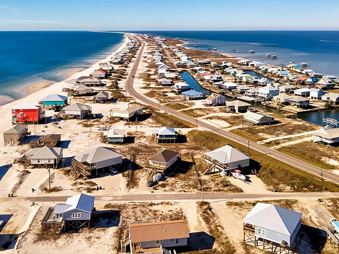A barrier island that refuses to surrender to overdevelopment. Beach houses stand like sentinels along Dauphin Island's pristine coastline, each with front-row sunset views.