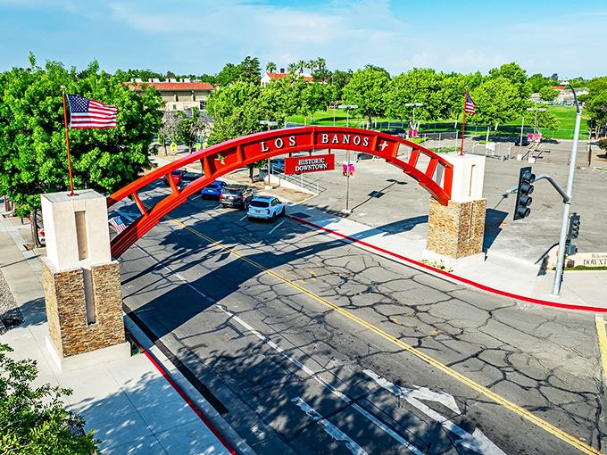 The iconic red arch welcomes you to Los Banos, where small-town charm meets affordable California living without the coastal price tag.