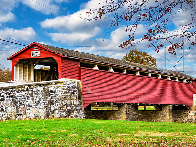 The classic barn-red exterior of Wehr Bridge stands in perfect contrast to Pennsylvania's lush greenery, like a Norman Rockwell painting come to life.