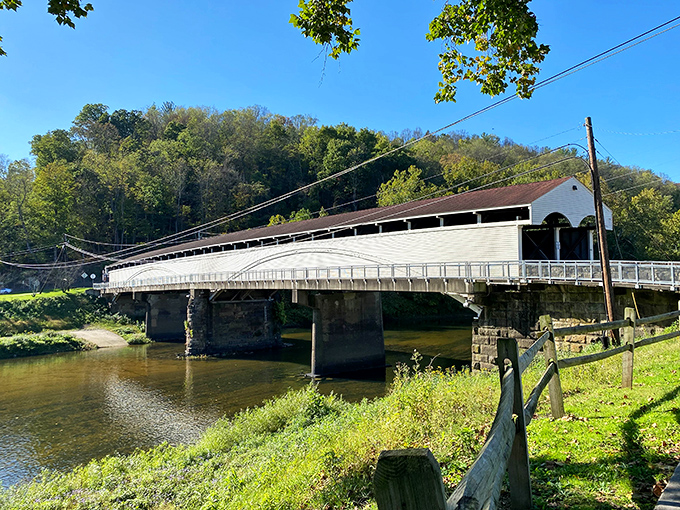 The grand dame of West Virginia bridges stands proudly over the Tygart Valley River, her white-washed exterior gleaming like a historical supermodel posing for her close-up.