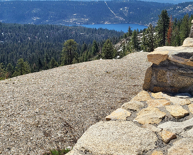 Mother Nature showing off like she's auditioning for a calendar shoot. Silver Lake glistens below, surrounded by a forest so dense it could hide Bigfoot's entire extended family.