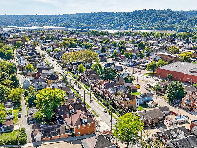 Ambridge unfolds like a storybook from above, its patchwork of neighborhoods nestled between rolling hills and the Ohio River's gentle curve.