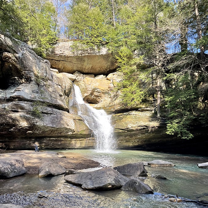 Nature's perfect cascade: Cedar Falls tumbles 50 feet over ancient sandstone, creating a pool so serene you'll want to bottle that tranquility for your next Zoom meeting.