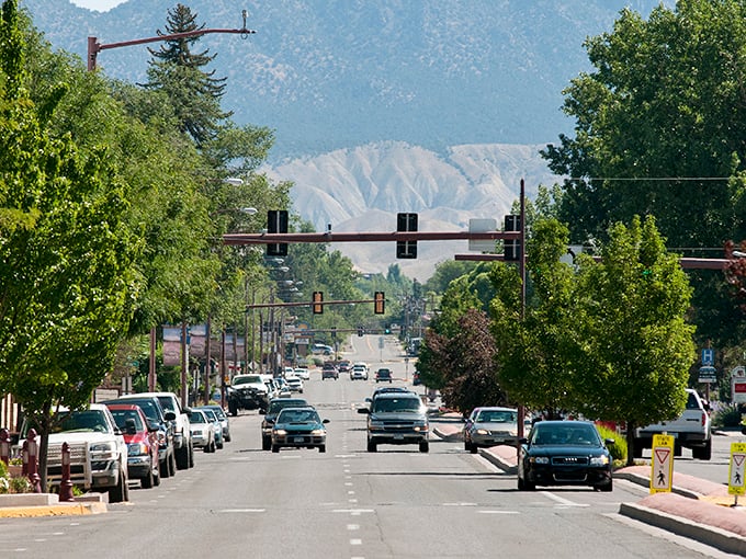 Main Street stretches toward the mountains like nature's welcome mat, inviting you to slow down and breathe in that crisp Colorado air.