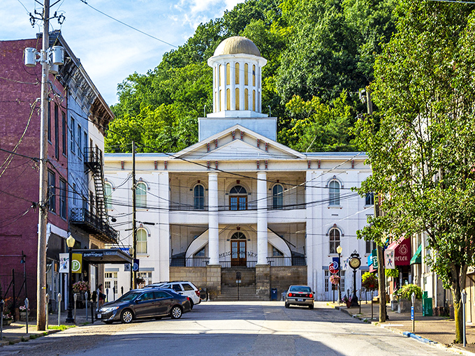 The Meigs County Courthouse commands attention with its gleaming white columns and golden dome, a Greek Revival masterpiece that's been watching over Pomeroy since 1848.