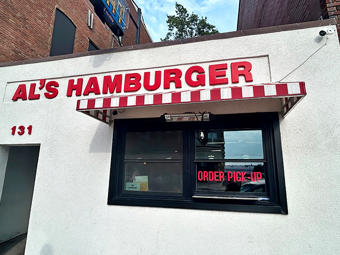 That vintage "EAT" sign hanging above Al's might be the most honest advertising in America. Trust me, you will.