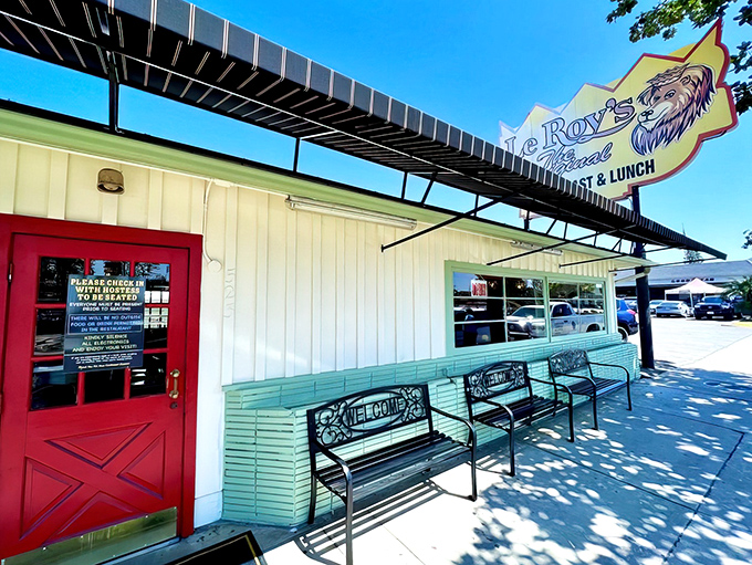The bright red door isn't just an entrance &ndash; it's a portal to breakfast paradise, complete with mint-green benches for contemplating pancake possibilities.
