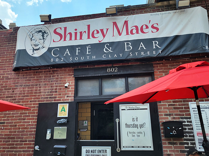 The unassuming brick facade of Shirley Mae's Cafe & Bar promises no frills, just thrills for your taste buds. Louisville's best-kept secret hides in plain sight.
