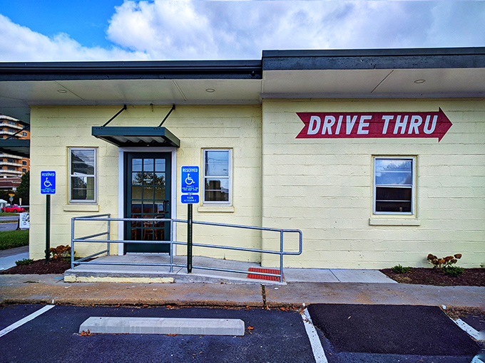 Even the accessibility ramp seems to say "hurry up and get in here" – that bright red drive-thru sign pointing the way to crispy chicken salvation.