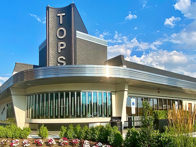 The gleaming art deco fa&ccedil;ade of Tops Diner stands like a beacon of culinary promise against the New Jersey sky, its retro-modern design practically whispering "come hungry, leave happy."
