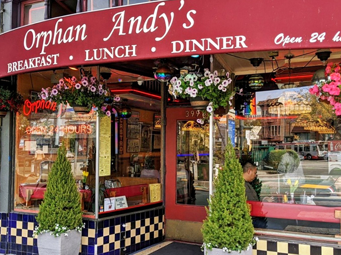 The iconic red awning of Orphan Andy's beckons hungry San Franciscans like a breakfast lighthouse in the Castro's colorful landscape.