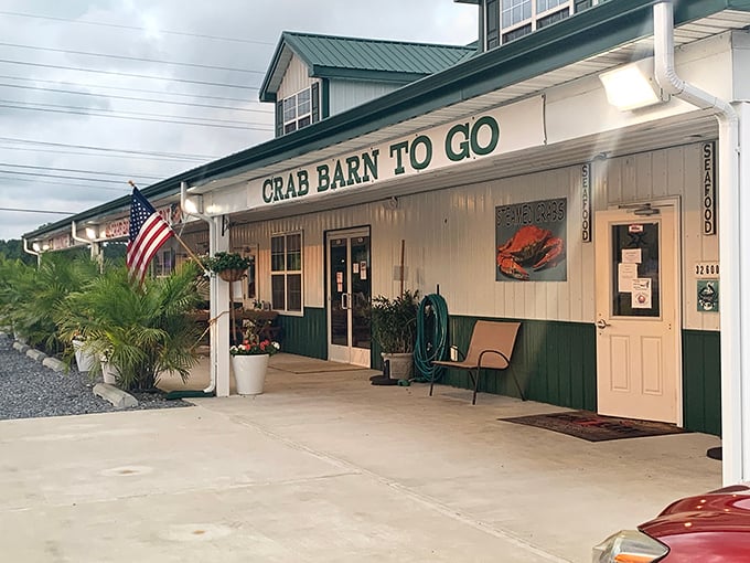 The classic white-and-green exterior of Crab Barn beckons seafood lovers like a lighthouse guides ships&mdash;toward delicious waters.