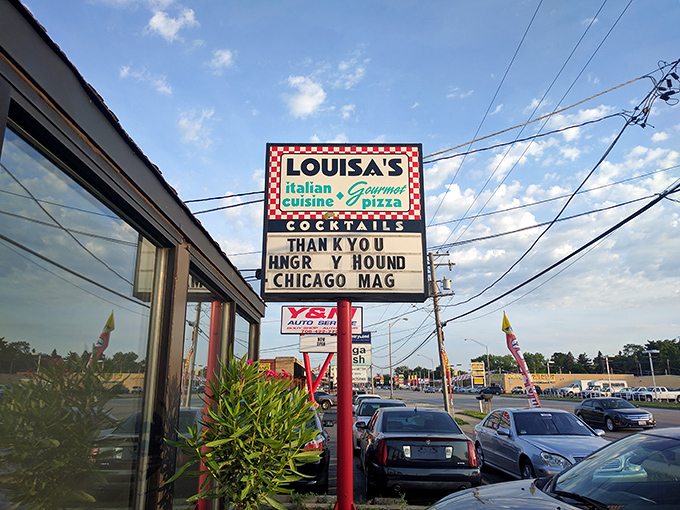 The checkered-border sign promises three essential food groups: Italian cuisine, gourmet pizza, and cocktails. The holy trinity of suburban dining bliss.