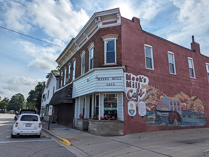 The unassuming exterior of Meek's Mill Cafe, with its charming mural, stands as a beacon for hungry travelers. Small-town Michigan at its most delicious.
