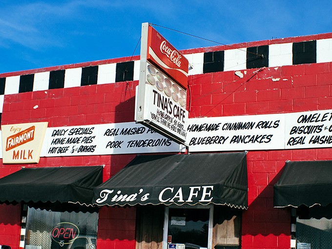 The red building with its checkered racing flag trim isn't just eye-catching&mdash;it's a roadside beacon promising comfort food that'll make your taste buds do victory laps.