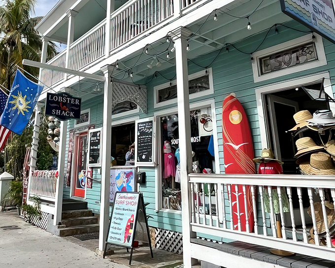 The seafoam-green facade of The Lobster Shack beckons like a siren song to seafood lovers. Complete with surfboard and straw hats, it's Key West distilled into architectural form.
