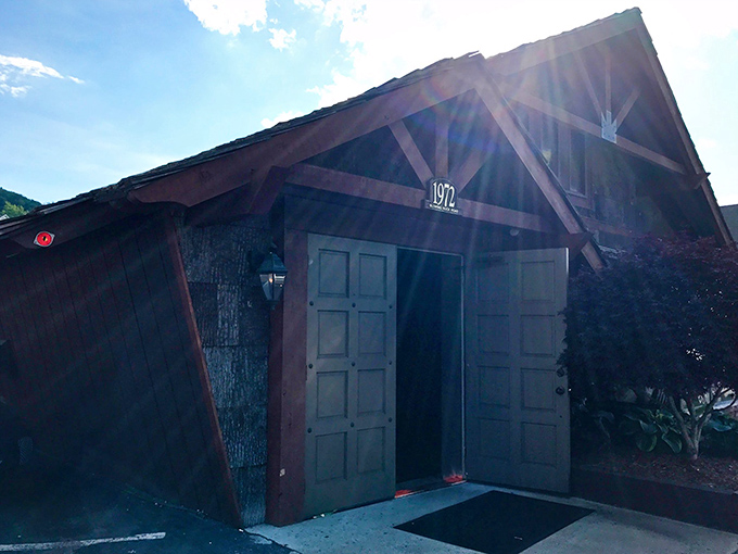 Sunlight dances across the wooden beams as the unassuming entrance promises meaty treasures within this mountain steakhouse sanctuary.