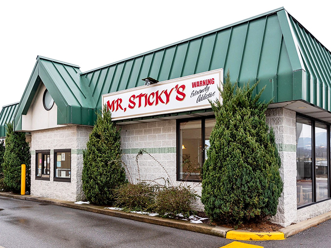 The unassuming green-roofed building houses Pennsylvania's sticky bun headquarters. That "WARNING" sign isn't kidding—prepare for delicious addiction!
