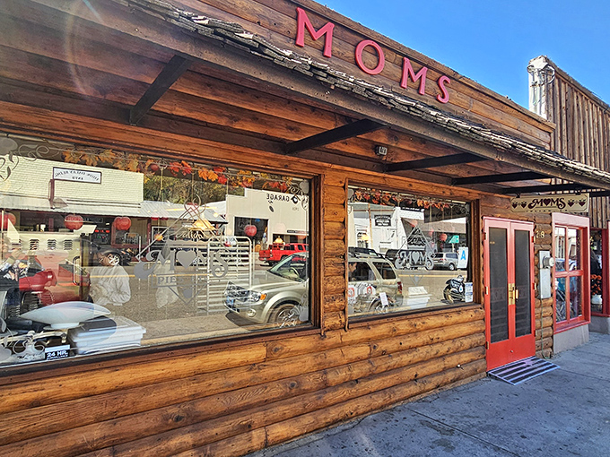 The rustic wooden exterior of Mom's Pie House beckons like an old friend, its red lettering promising homemade comfort in the heart of Julian's apple country.