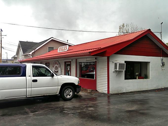 The iconic red roof of Hinkle's stands out like a beacon for burger pilgrims, promising simplicity in a world gone mad with food trends.