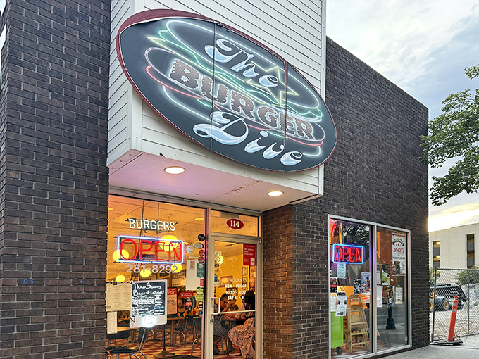 The neon glow of The Burger Dive's sign beckons like a lighthouse for the hungry, promising salvation in the form of perfectly crafted patties.