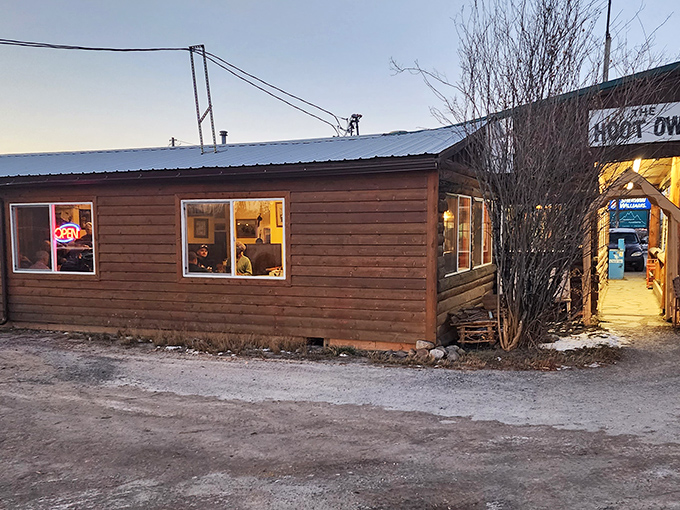 The unassuming wooden exterior of Hoot Owl Caf&eacute; glows with promise at dusk, like a beacon calling hungry travelers home.