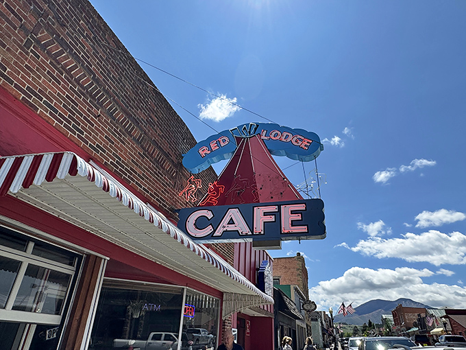 The iconic neon teepee sign beckons hungry travelers like a beacon of breakfast hope against Montana's impossibly blue sky.