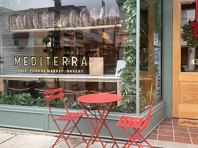 Those charming red bistro tables outside Mediterra Café aren't just for show – they're your front-row seats to Sewickley's most delicious Mediterranean escape.