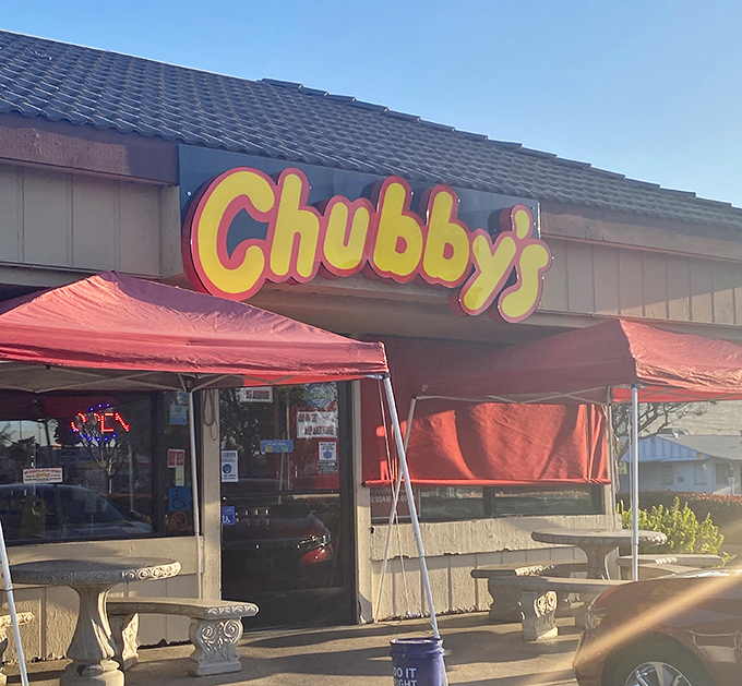 The bright yellow and red sign of Chubby's Diner beckons like a lighthouse for the hungry. No fancy frills, just the promise of honest-to-goodness comfort food.