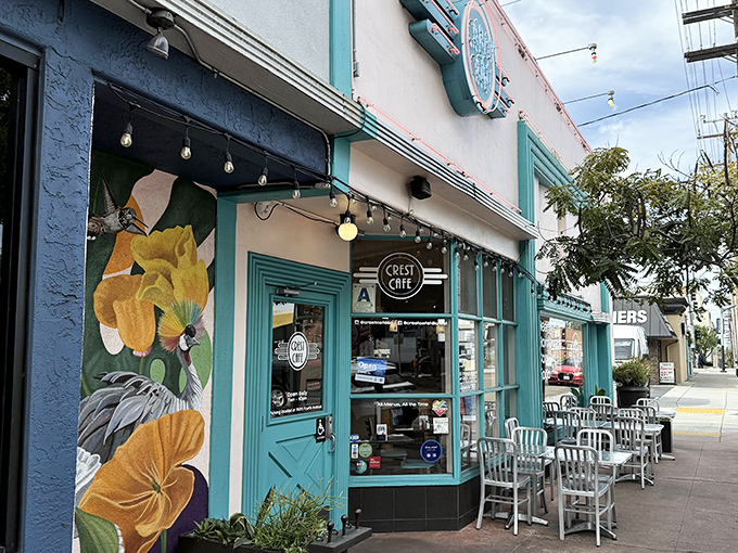 The turquoise dream beckons! Crest Cafe's vibrant exterior with its stunning floral mural promises a colorful experience before you even step inside.
