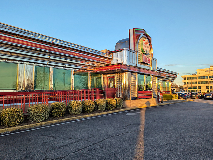 The classic chrome-and-neon exterior of Double T Diner gleams in the golden hour light, a shiny time capsule promising comfort food and nostalgia inside.