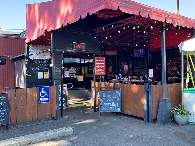 The unassuming entrance to DK Diner, where that red awning might as well be a superhero cape signaling "deliciousness happens here."