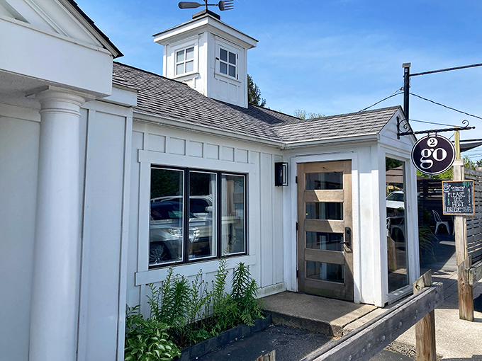A charming farmhouse-inspired exterior with the distinctive "2go" sign beckoning hungry travelers. This isn't just a building&mdash;it's a breakfast beacon.
