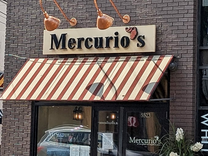 The iconic red and white striped awning of Mercurio's beckons like a culinary lighthouse on Walnut Street, promising authentic Italian delights within.